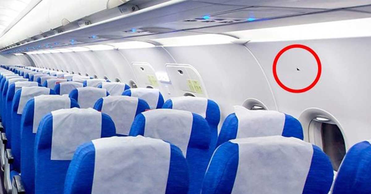 The Mystery of the Triangle Stickers Above Airplane Seats—What Do They ...